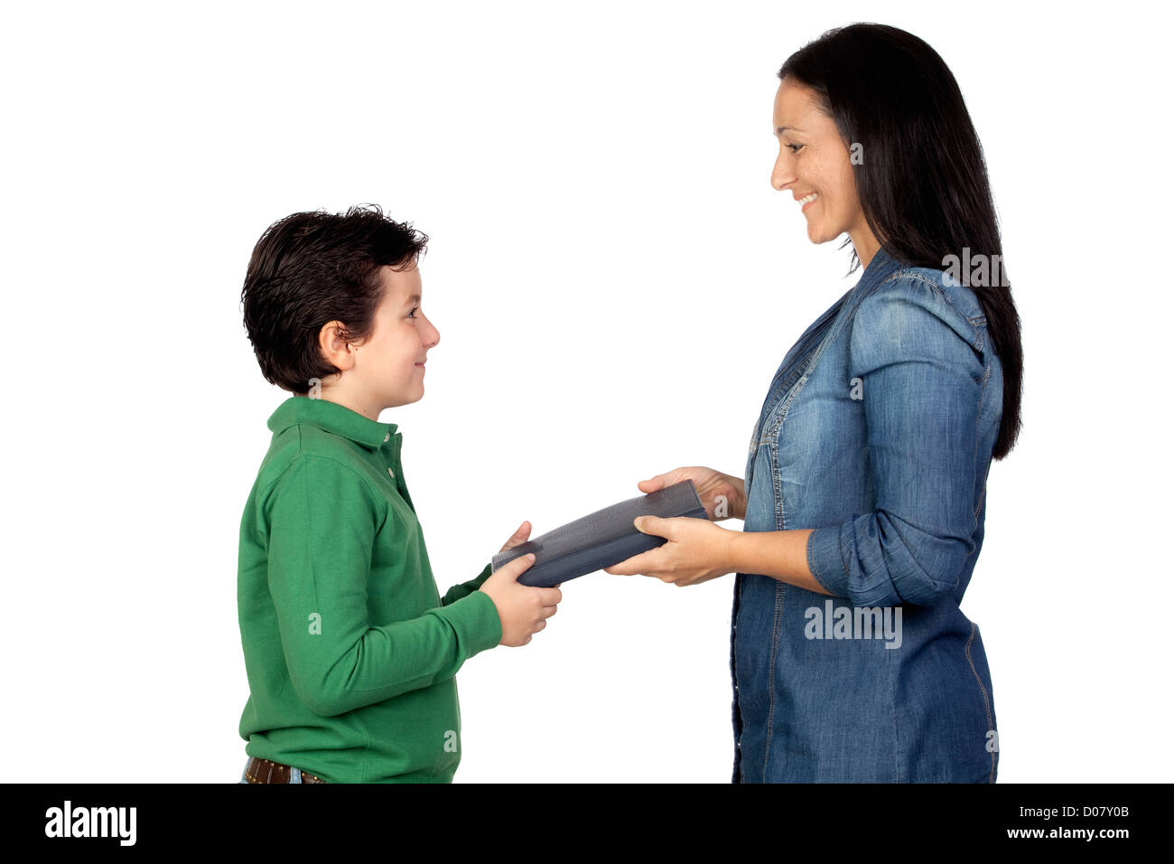 Mother handing a book to his son isolated on white background Stock ...
