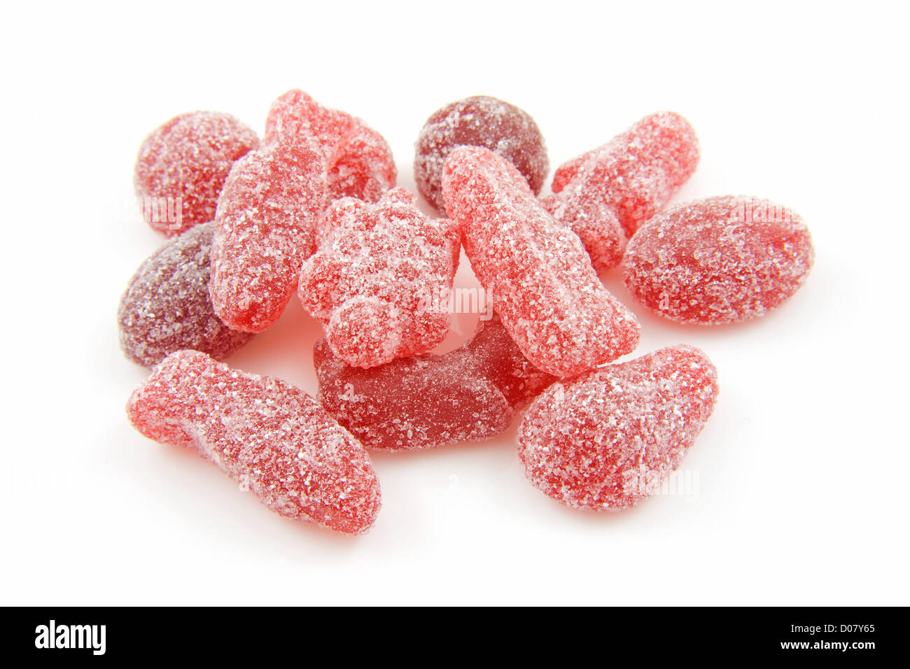 red sugared candy sweets over white background Stock Photo - Alamy