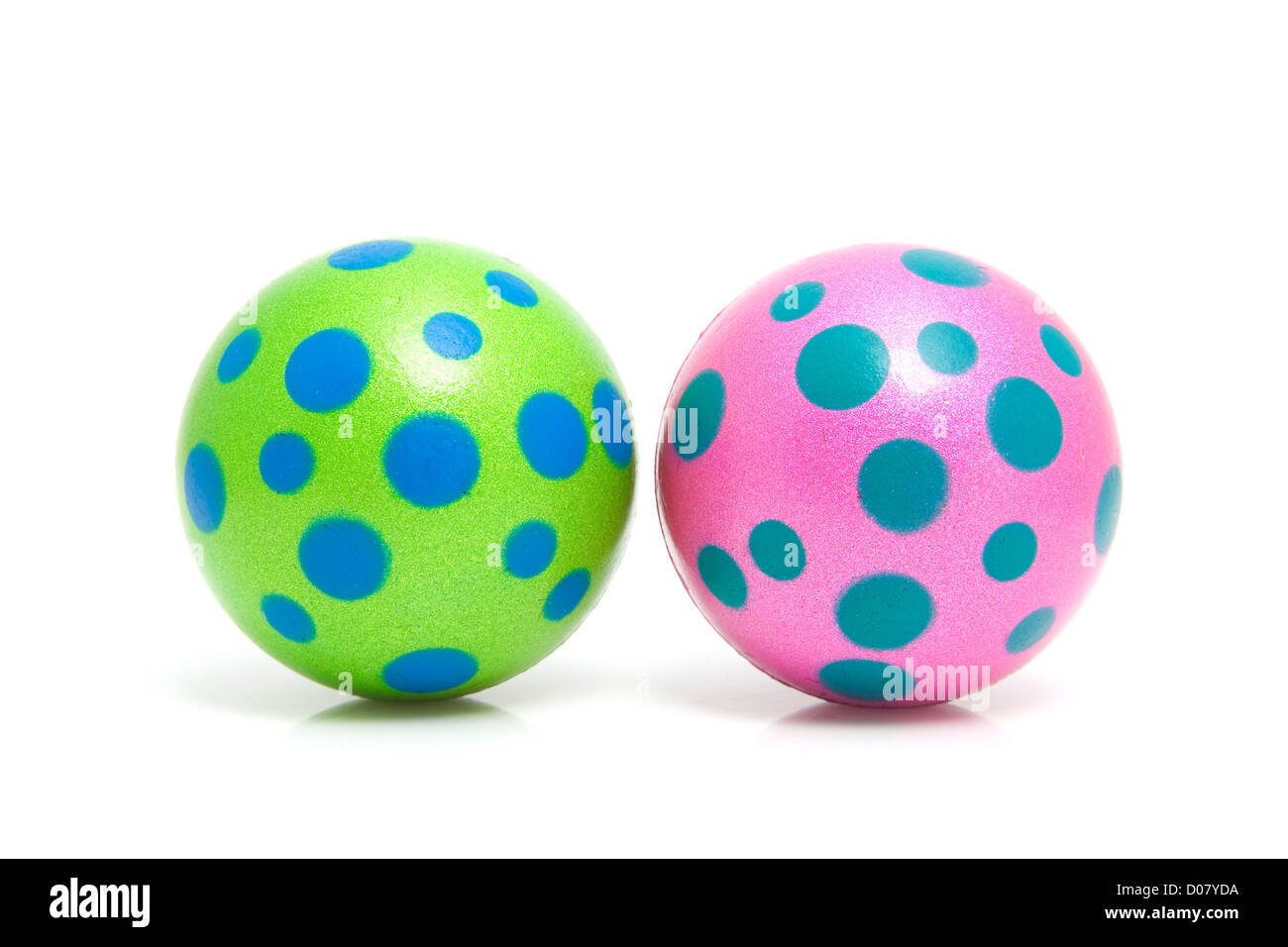 Two colorful dotted balls over white background Stock Photo - Alamy