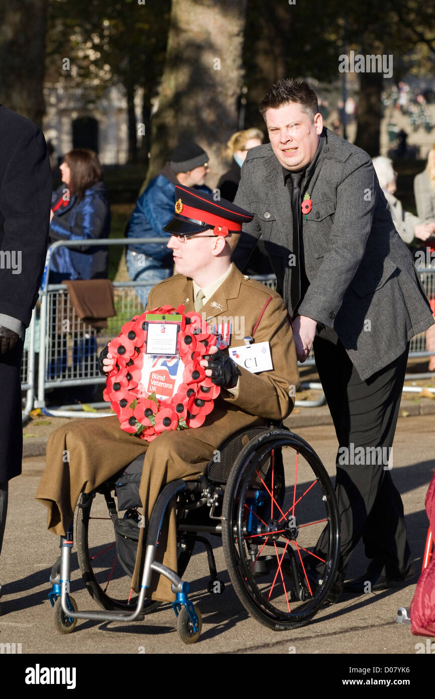 A Solider with no legs being pushed in his wheelchair on Remembrance ...