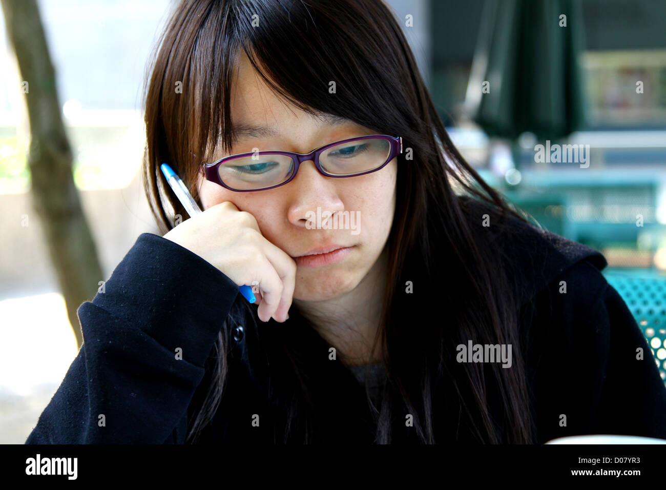Asian girl thinking Stock Photo - Alamy