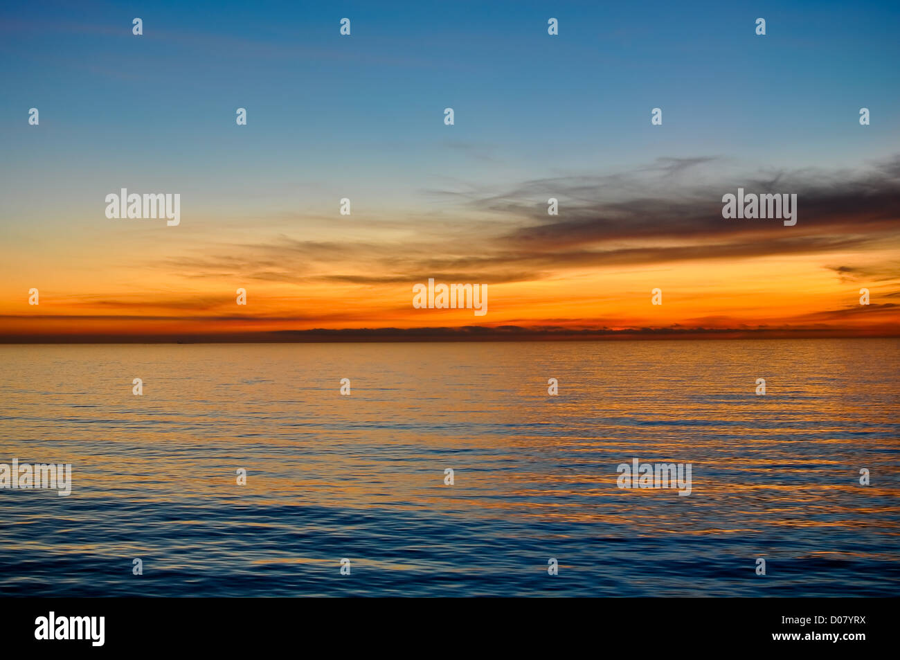 Ocean Background with Sunset in the back Stock Photo - Alamy