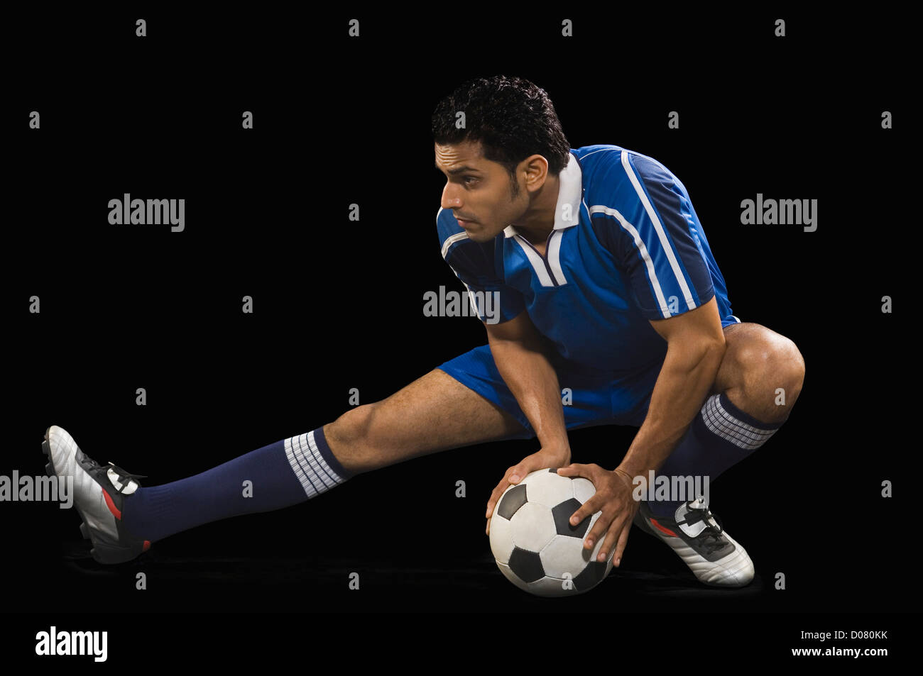 Man playing soccer Stock Photo - Alamy