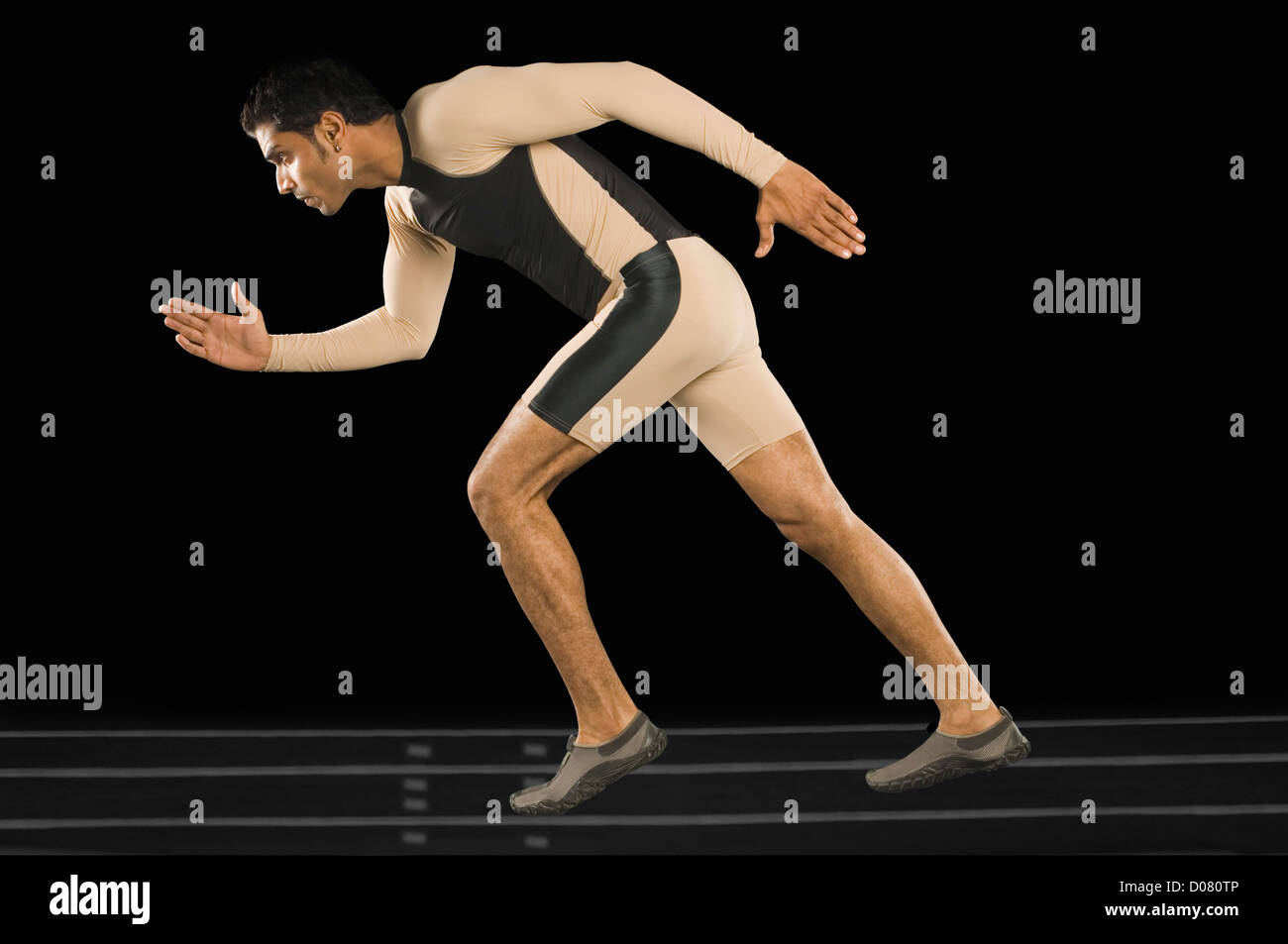 Athlete running on a running track Stock Photo - Alamy