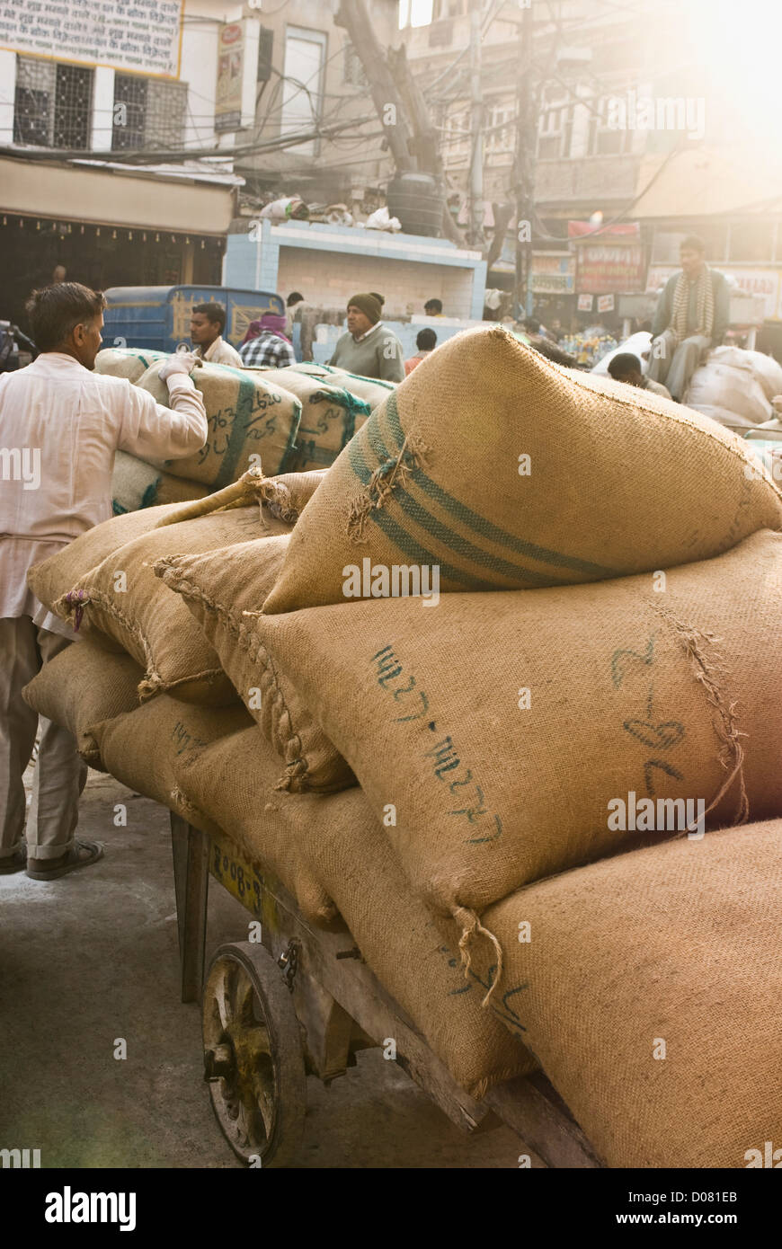 Grain loaded sacks on a push cart in a market, Delhi, India Stock Photo ...