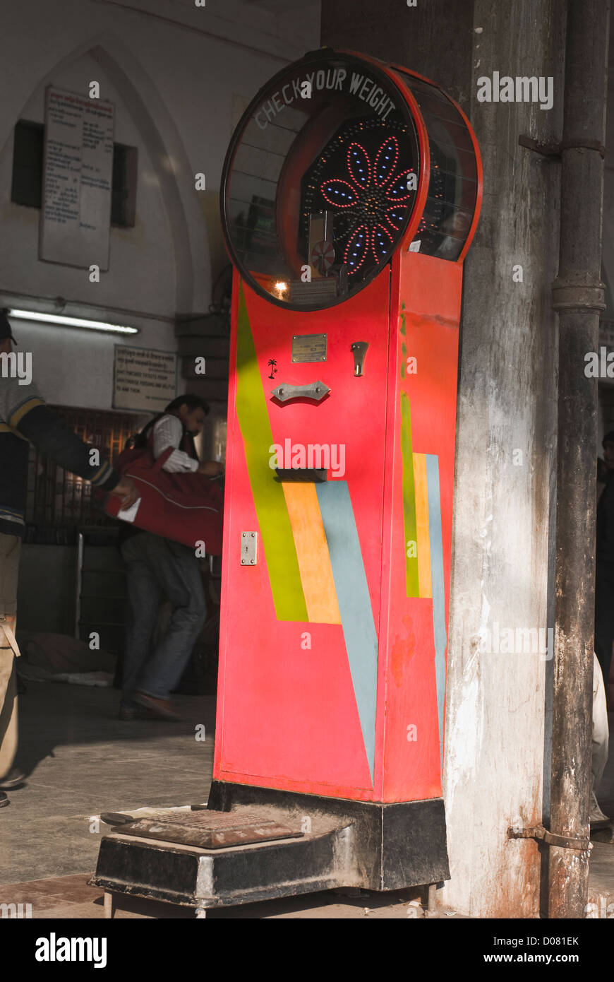 Weighing machine at a railway station, Delhi, India Stock Photo - Alamy