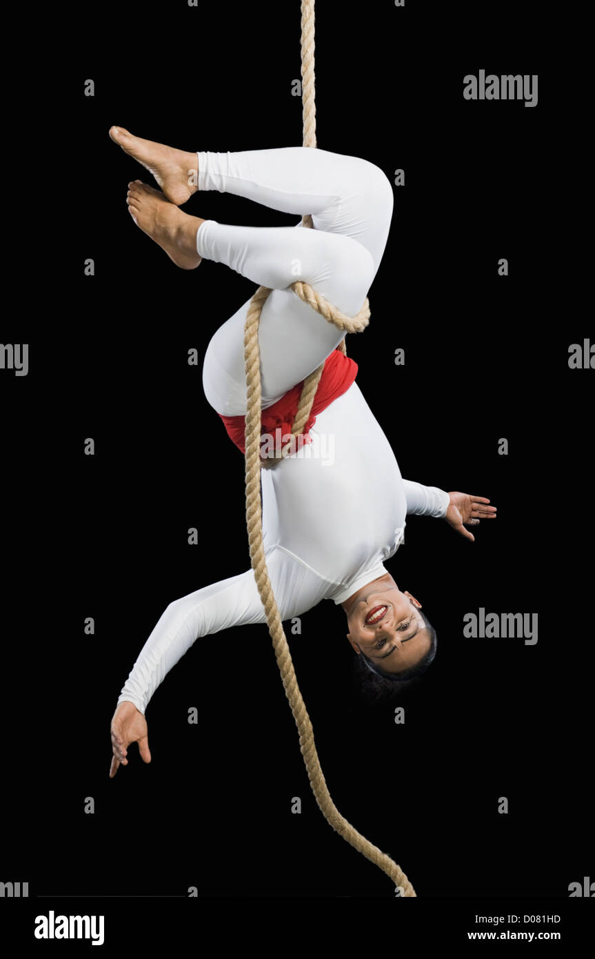 Man hanging upside down by a rope hi-res stock photography and images ...