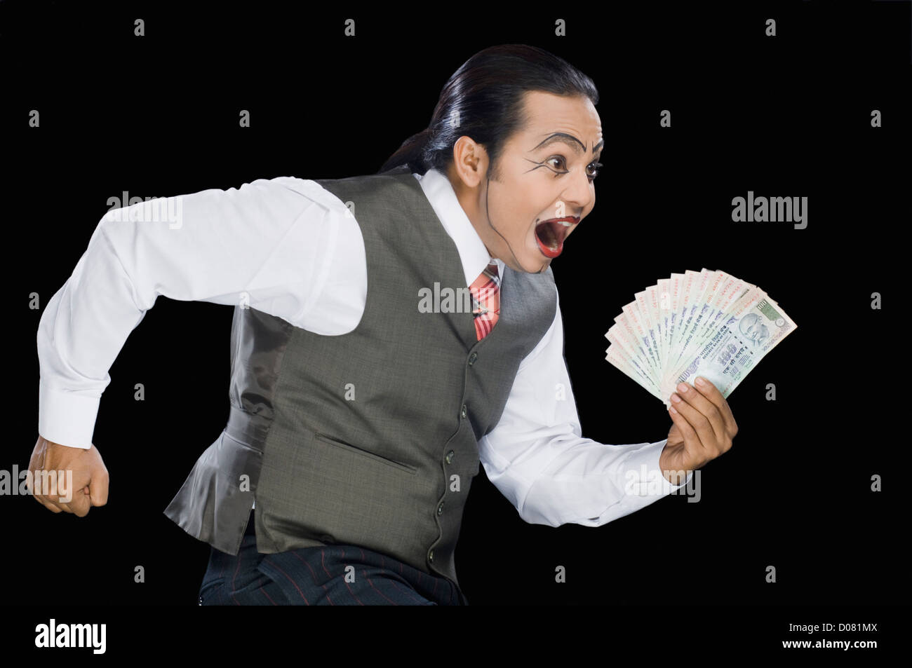 Close-up of a mime running with currency notes Stock Photo - Alamy