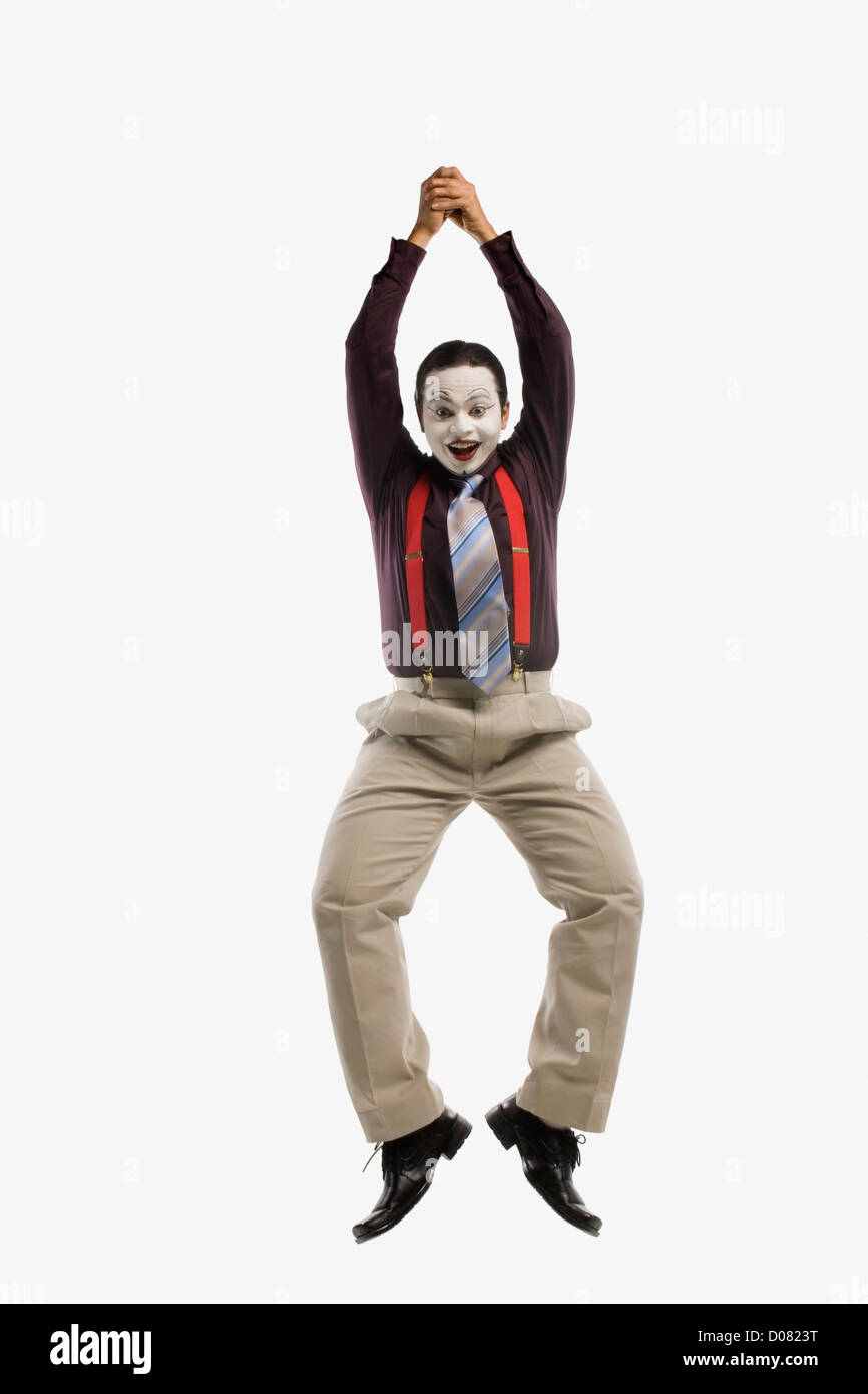 Mime falling isolated over a white background Stock Photo - Alamy