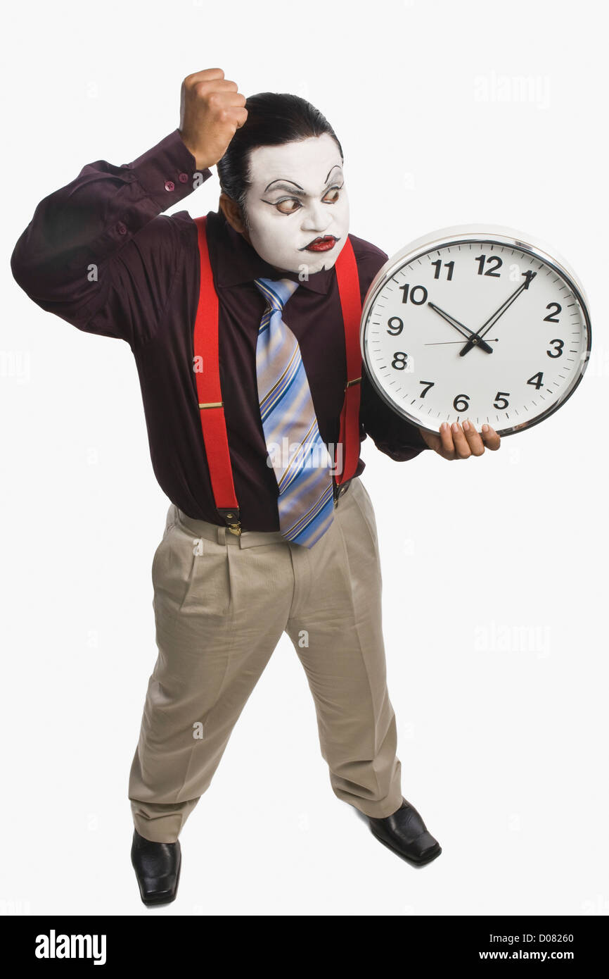 Mime showing a clock Stock Photo - Alamy