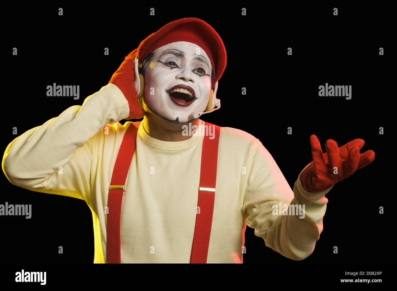 Close-up of a mime wearing a headset and singing Stock Photo - Alamy