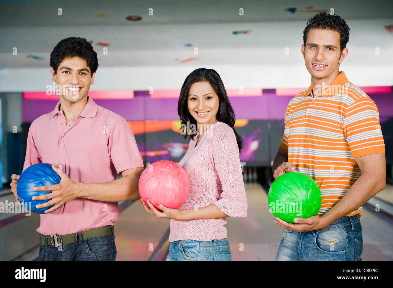 Portrait three friends in bowling hi-res stock photography and images ...
