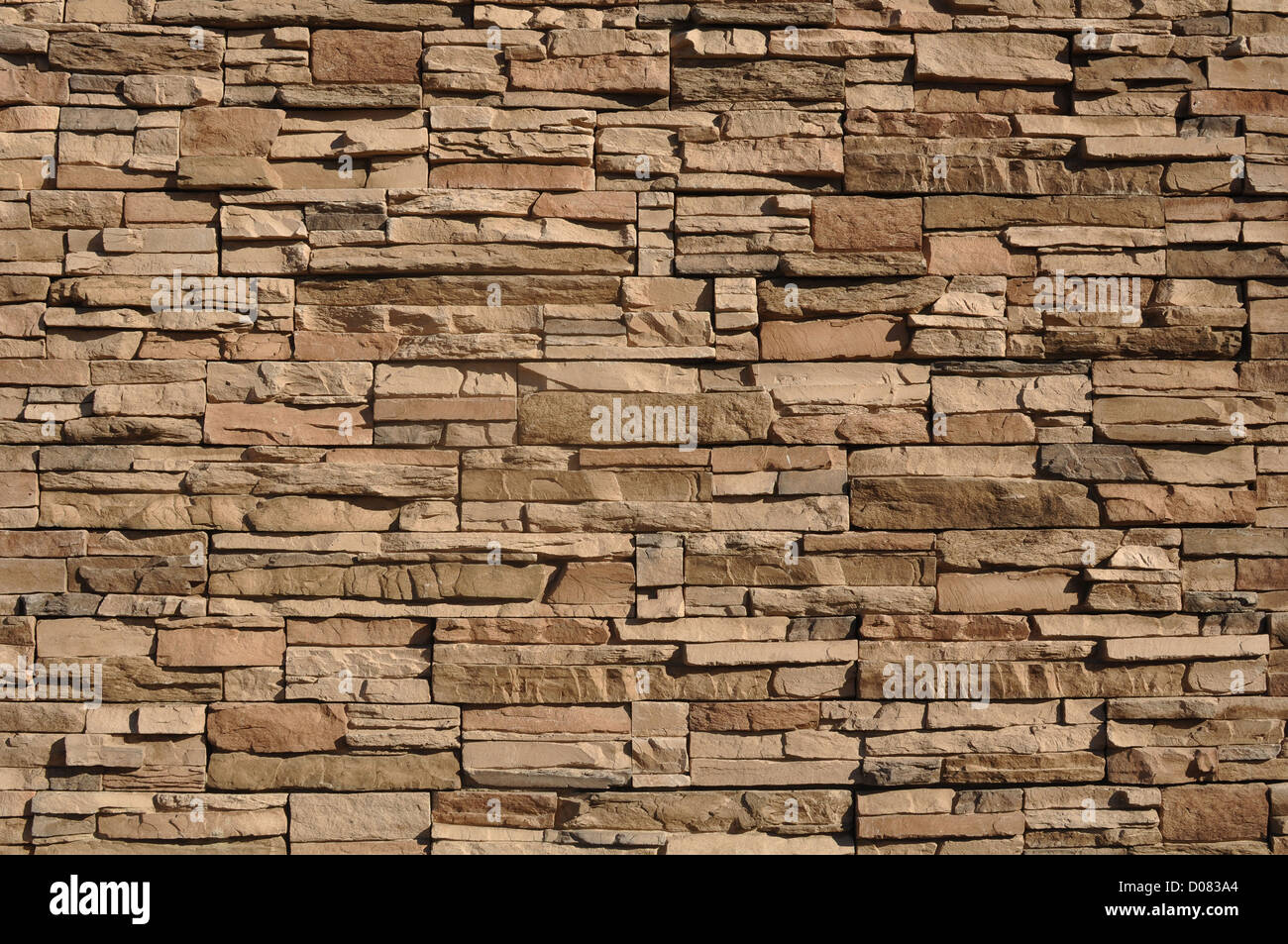 Modern Tan Stone Background with mixed size stone Stock Photo - Alamy