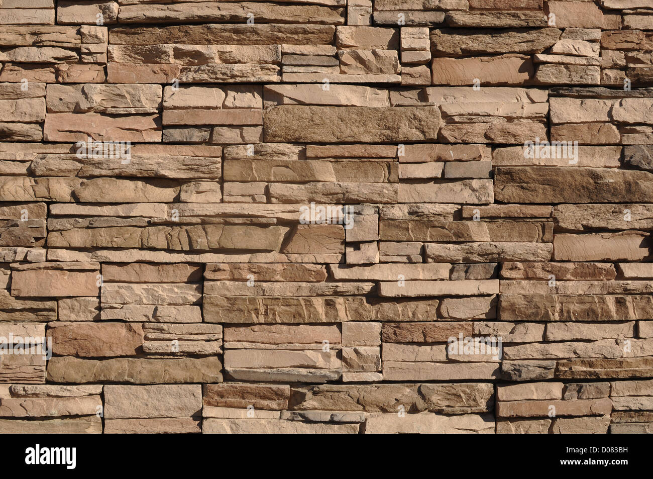 Modern Tan Stone Background with mixed size stone Stock Photo - Alamy