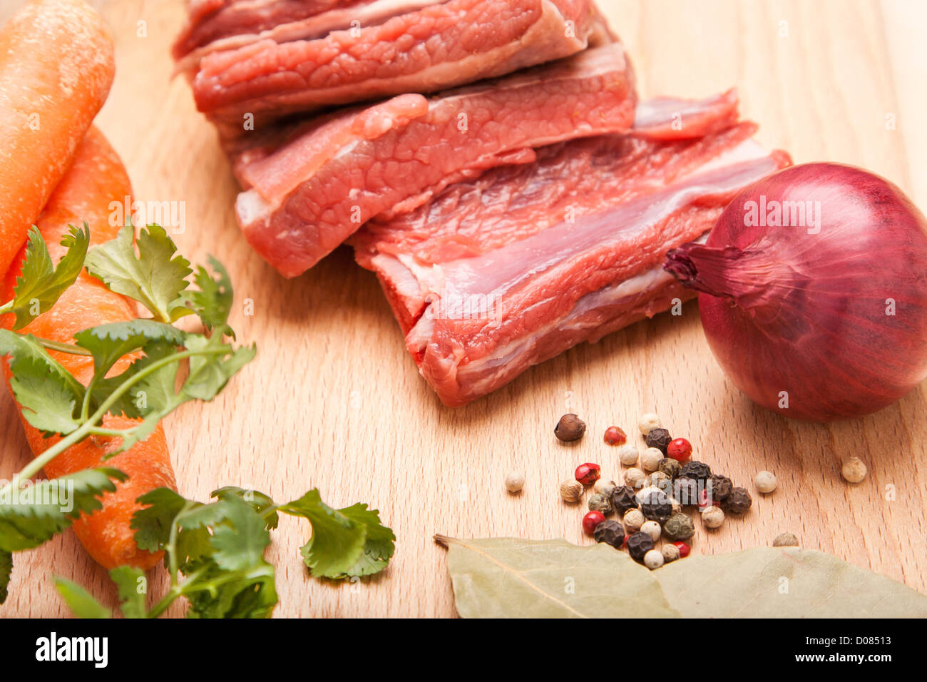 fresh meat with vegetables on board for cook Stock Photo - Alamy