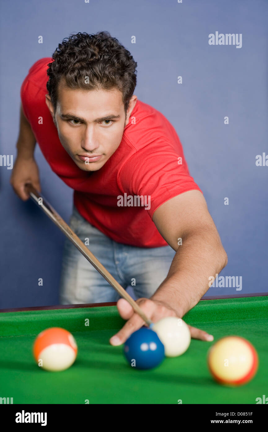 Young man playing pool Stock Photo - Alamy