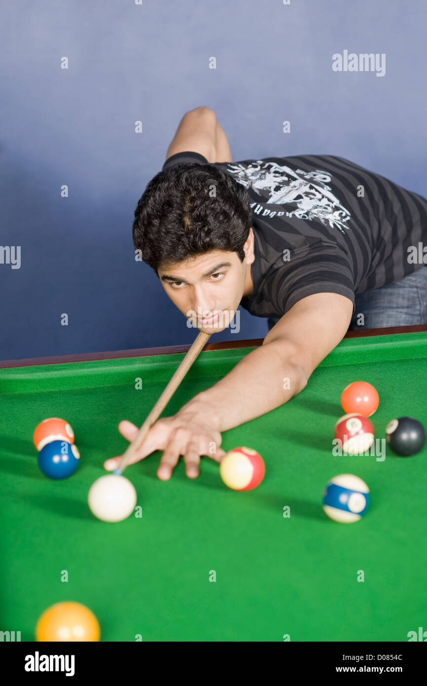 Young man playing pool Stock Photo - Alamy