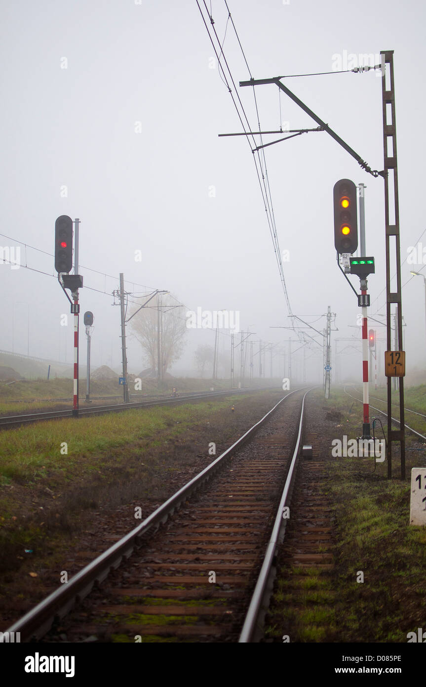 railroad tracks and lights in the fog Stock Photo - Alamy