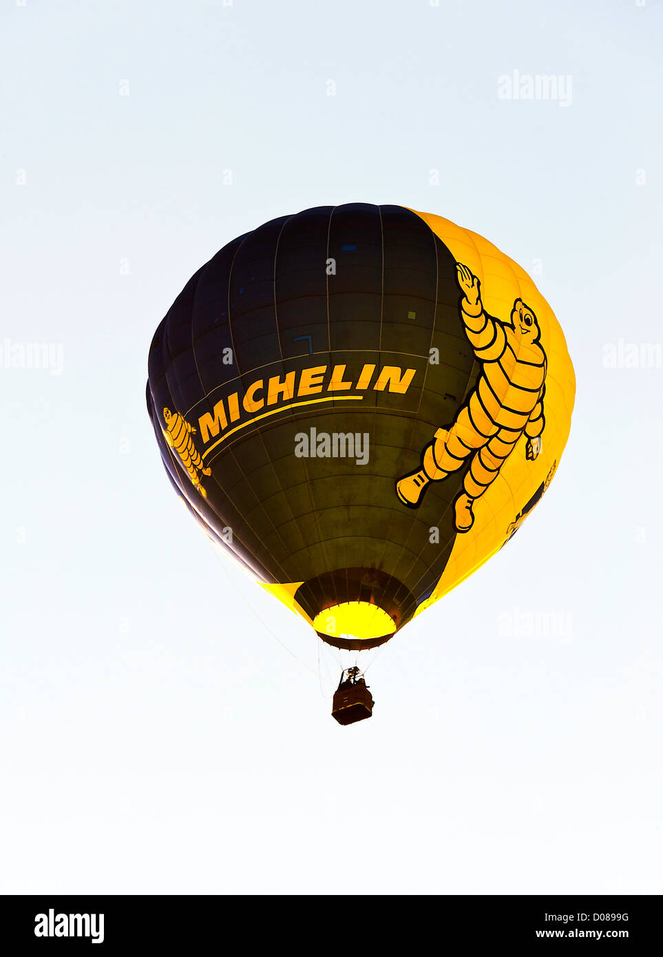 Michelin Hot Air Balloon Drifting in a Clear Sunlit Afternoon Sky Over ...