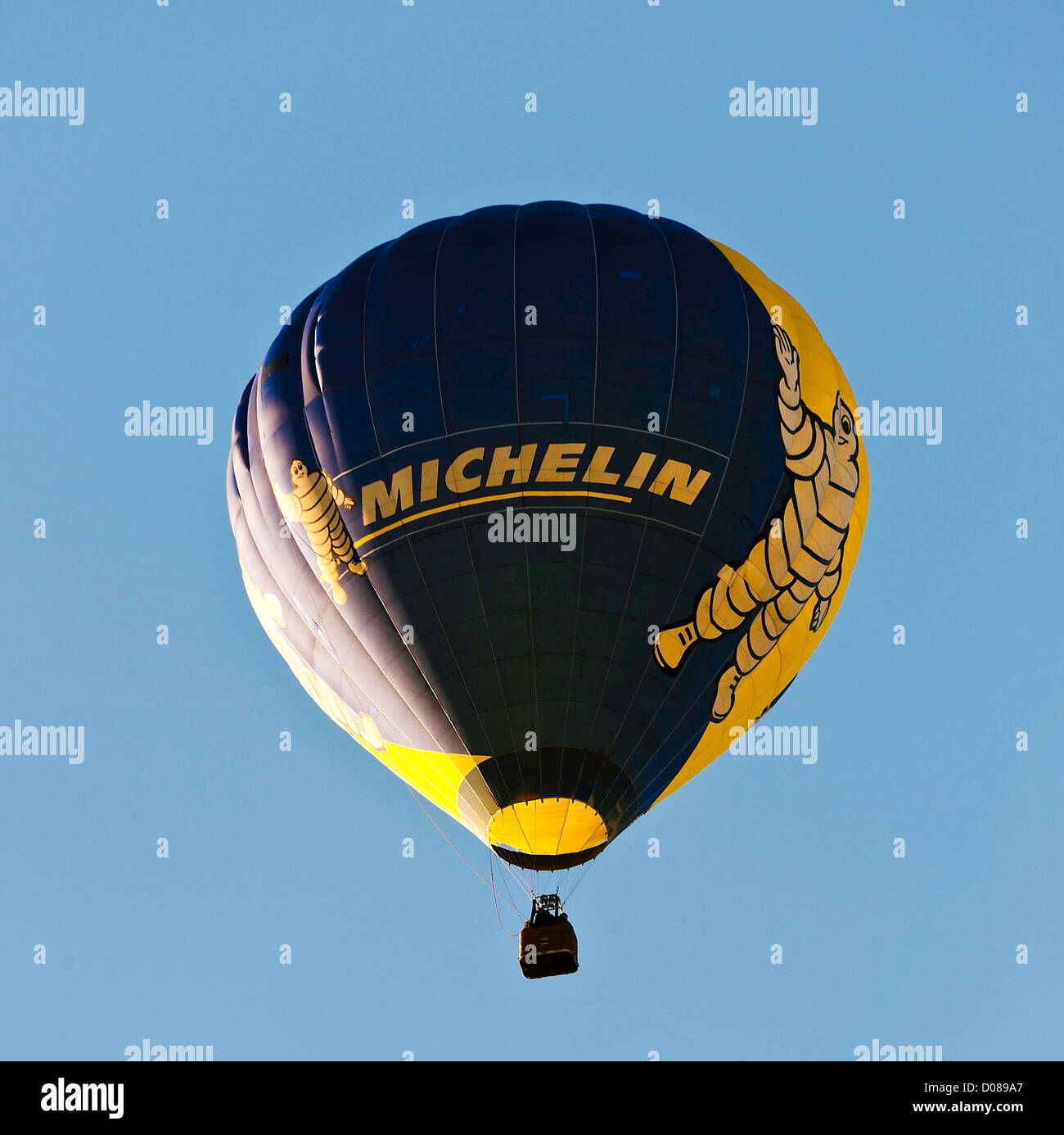 Michelin Hot Air Balloon Drifting in a Clear Sunlit Afternoon Sky Over ...