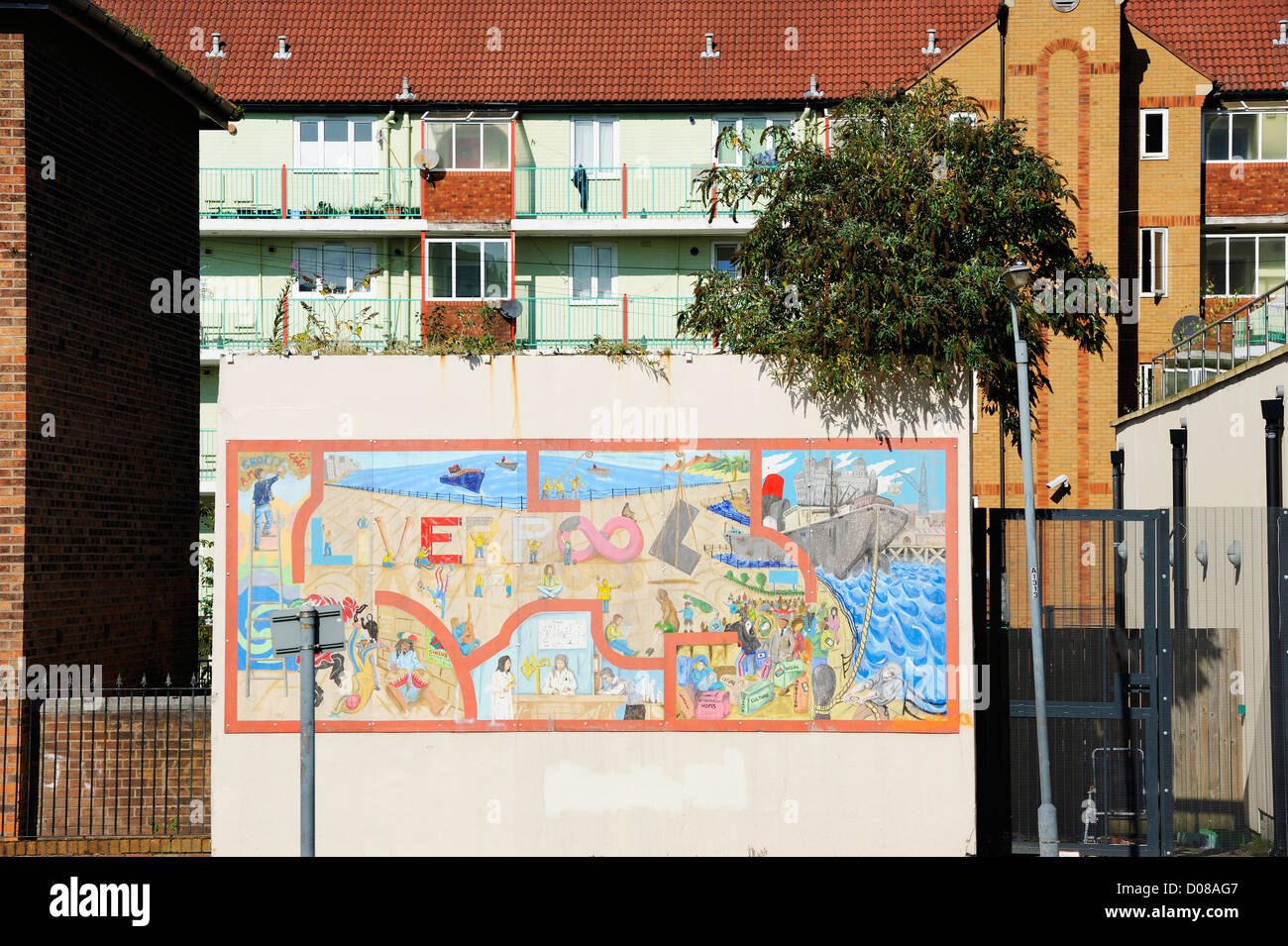 Graffiti on a wall in front of inner city housing in Liverpool Stock ...