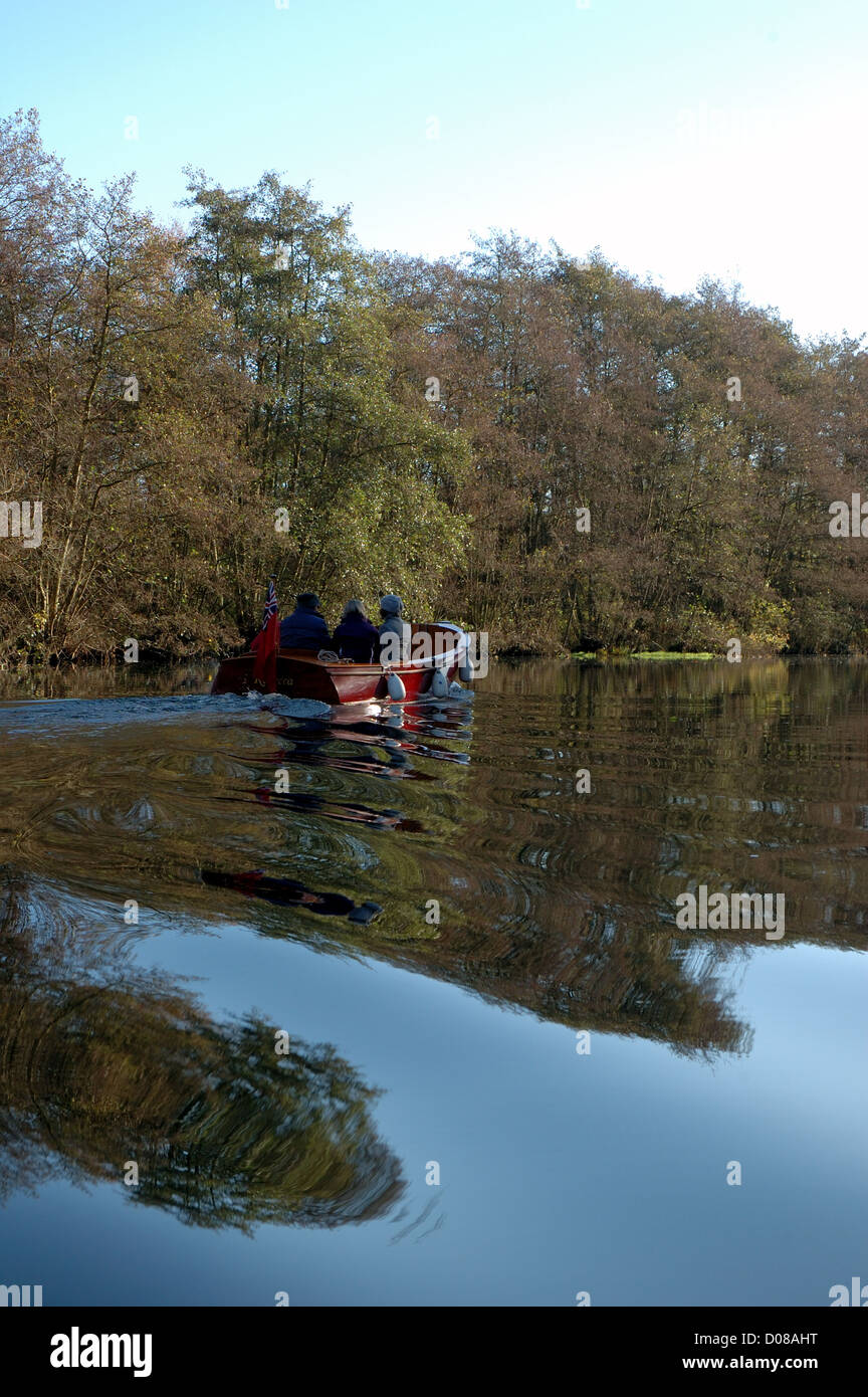 Traditional wooden motor boat on the River Bure between Belaugh and ...
