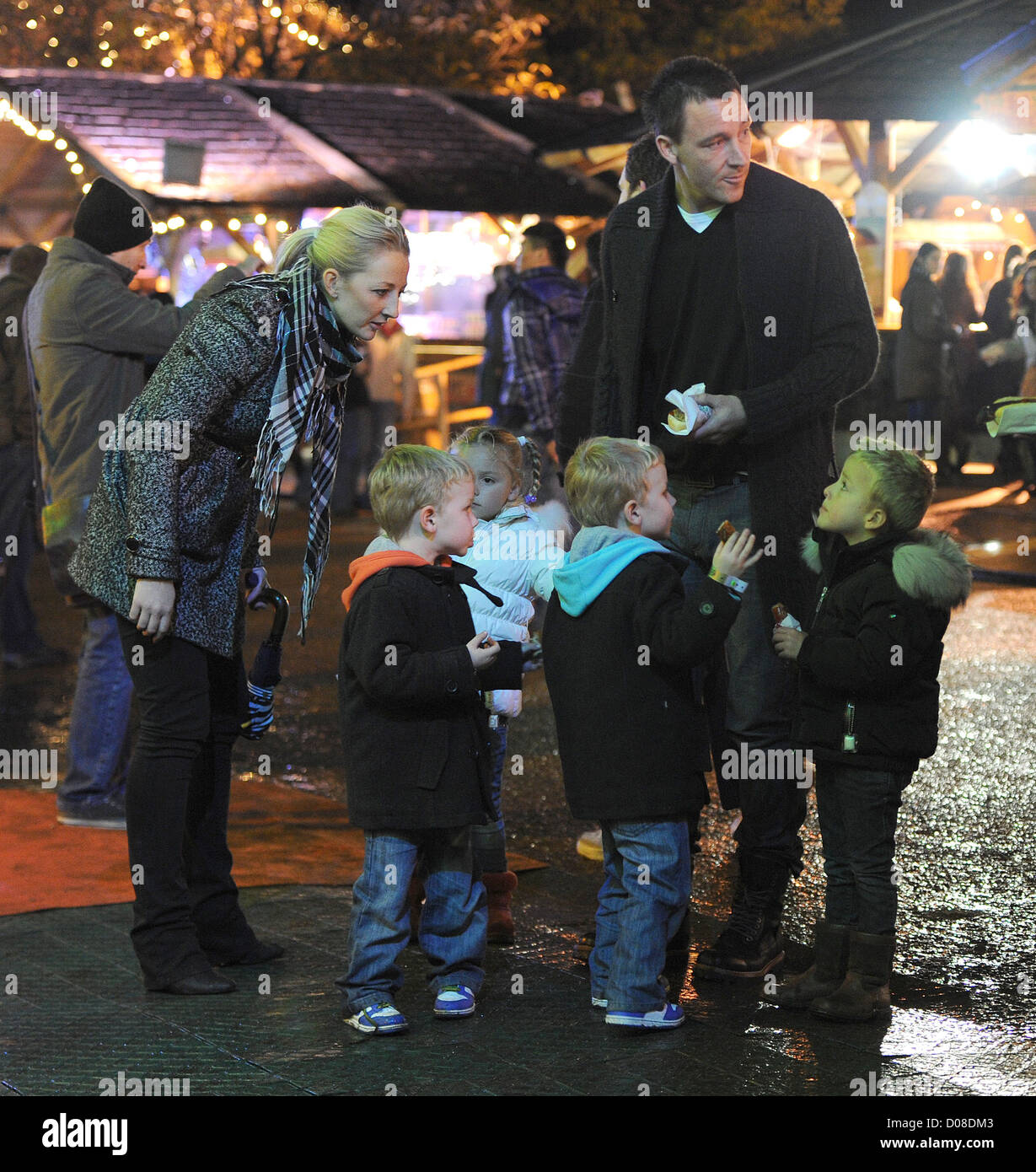 John Terry, Toni Terry and their children enjoy hot dogs, while ...