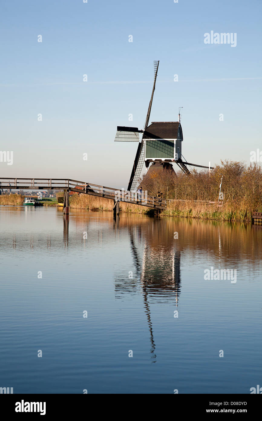 Windmill called "Achterlandse Molen" along a canal, Groot Ammers, South ...