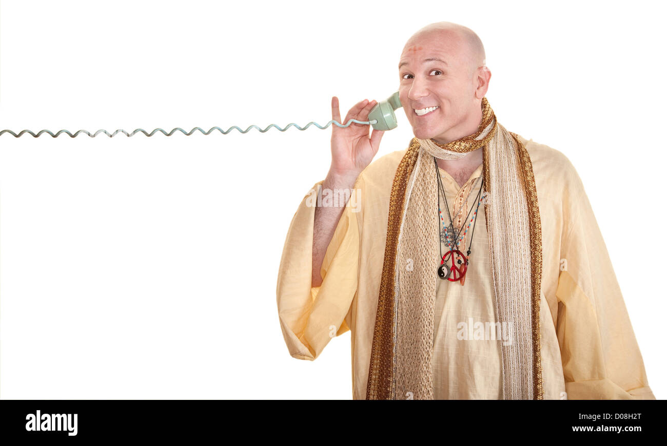Bald Caucasian monk grins on phone call over white background Stock ...
