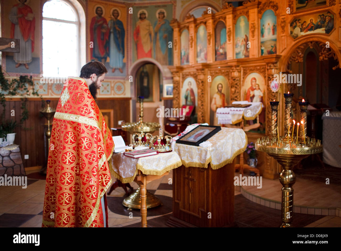 Catholic priest during consecration in hi-res stock photography and ...