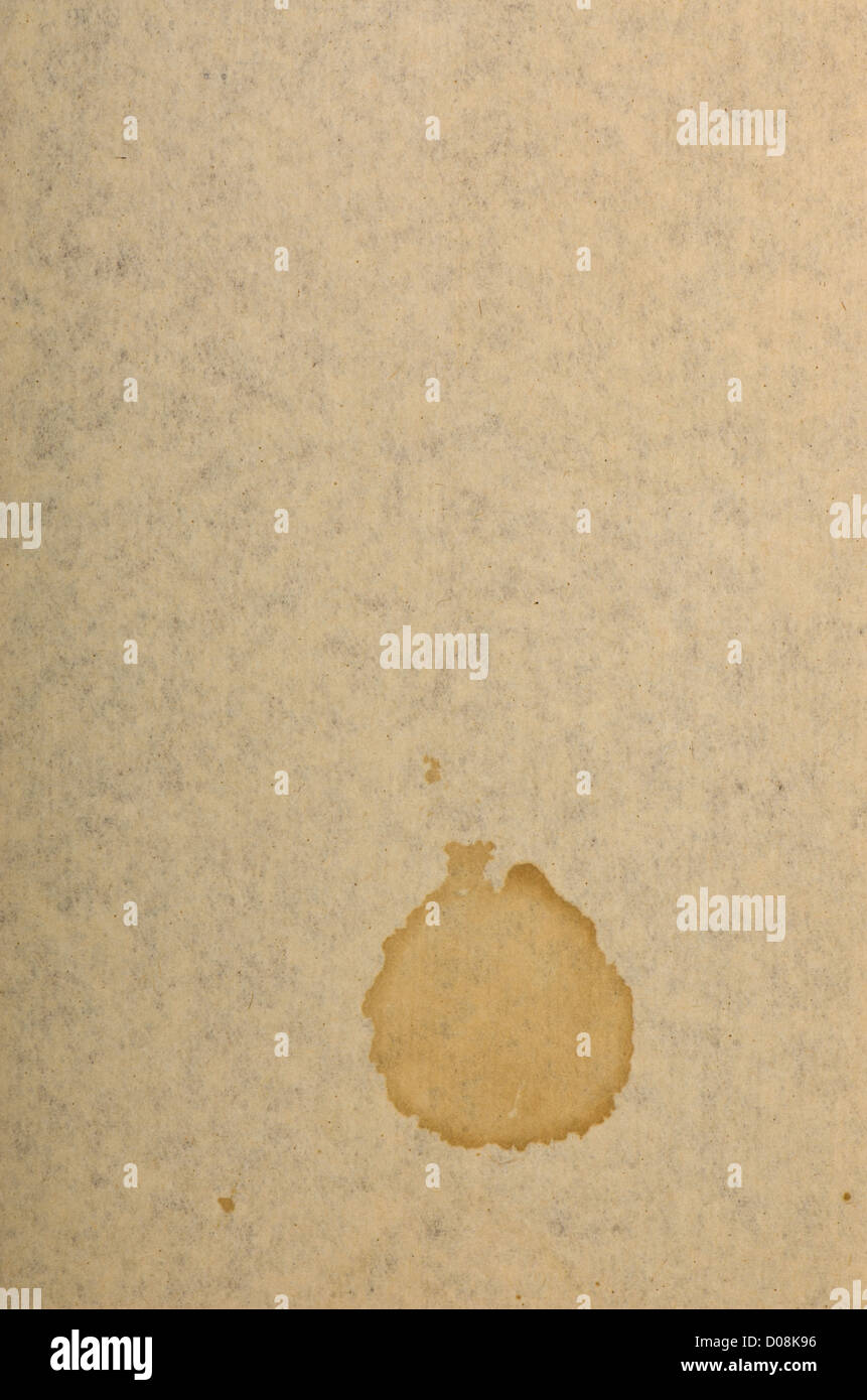 Page of old run-down paper with a stain Stock Photo - Alamy