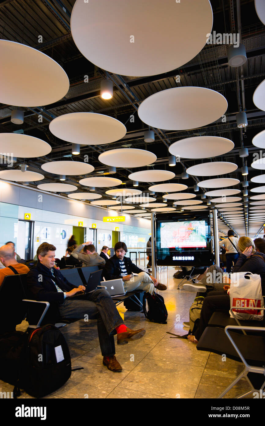 England, London, Heathrow Airport Terminal 5 disc ceiling in departures ...