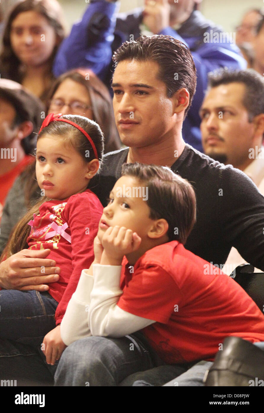 Mario Lopez and his family watch members of BGCV perform a pantomime on ...
