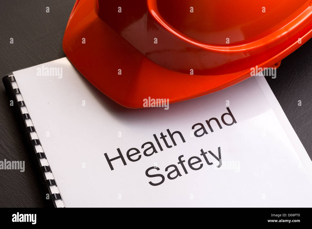 Health and safety register with helmet Stock Photo - Alamy