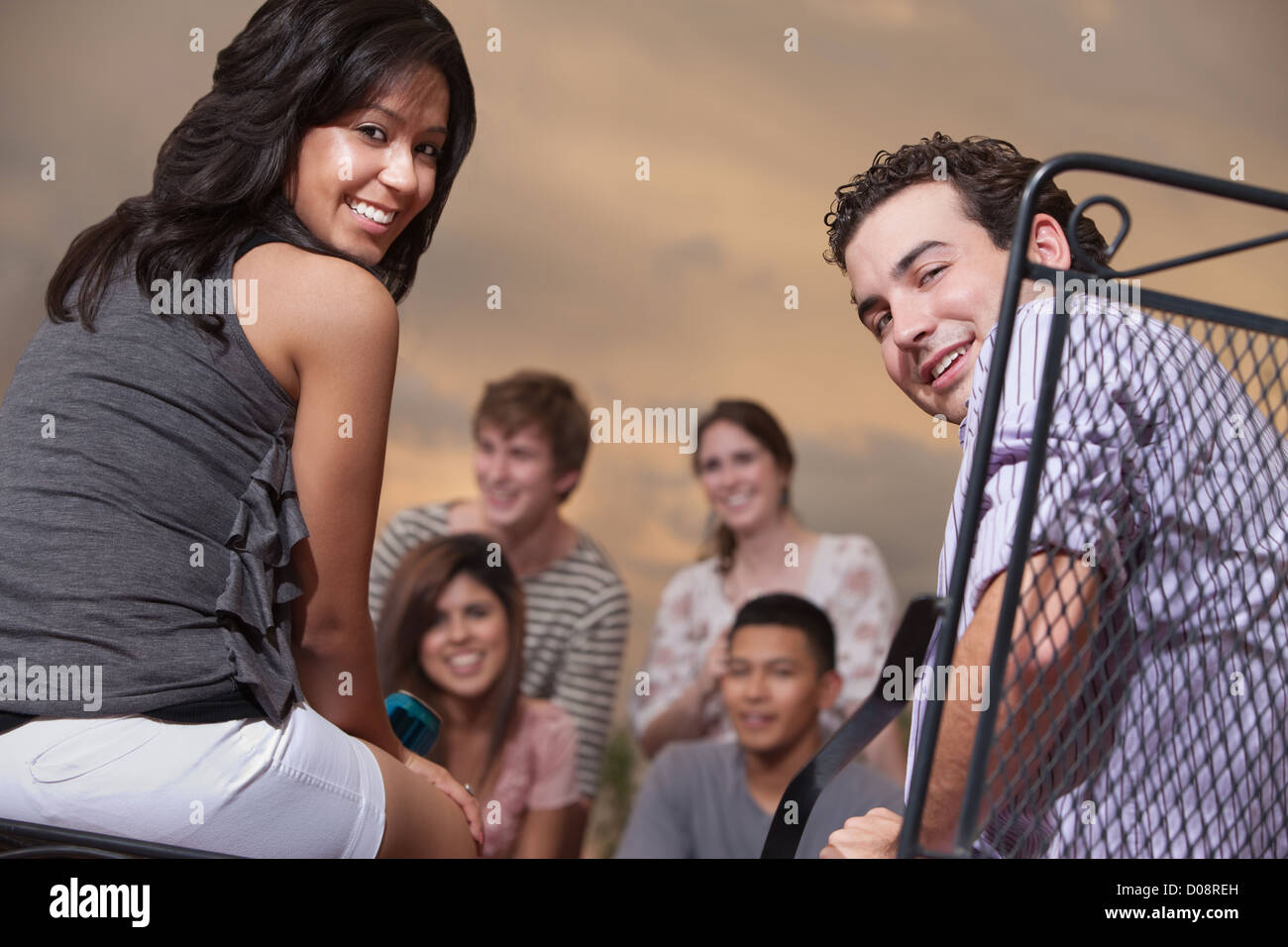 Group of six happy friends laugh together at sunset Stock Photo - Alamy