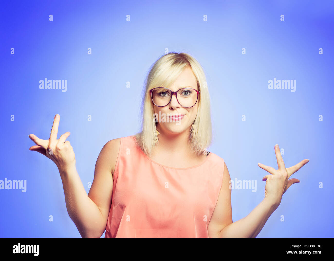 Smart college student shrugging isolated on a blue background Stock ...