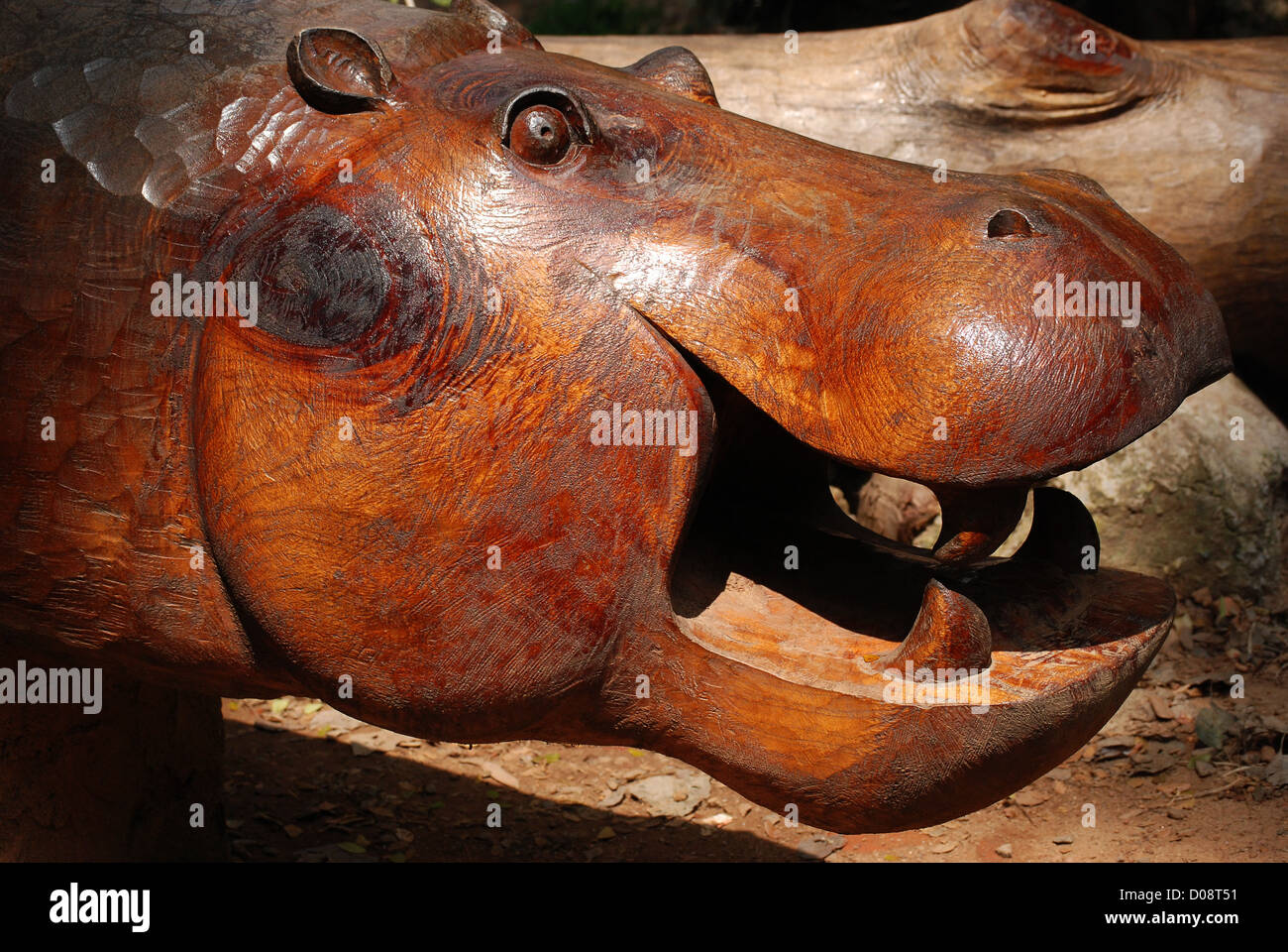 wood sculpture of hippo or hippopotamus Stock Photo - Alamy