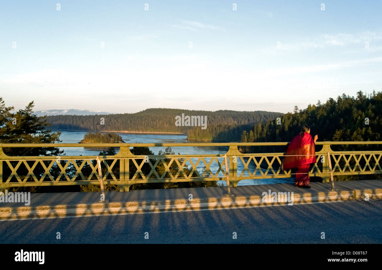 Woman standing on bridge Stock Photo - Alamy