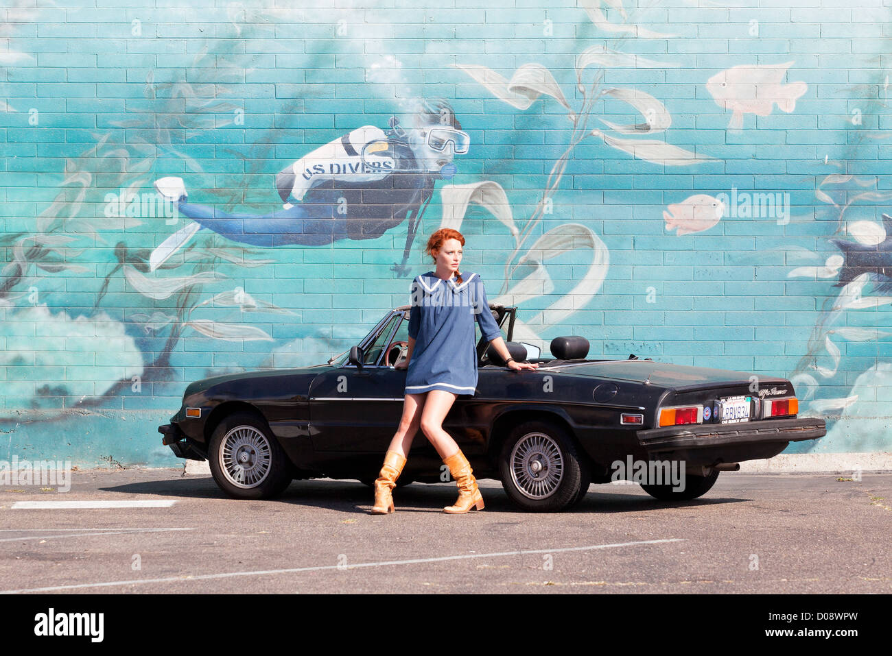 Girl poses with vintage car Stock Photo - Alamy