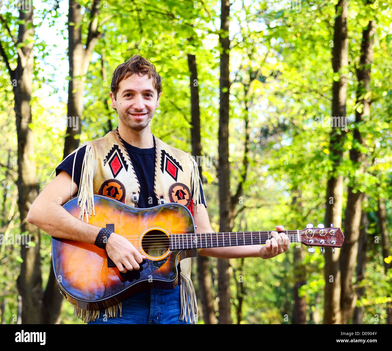 Happy guy playing guitar Stock Photo - Alamy