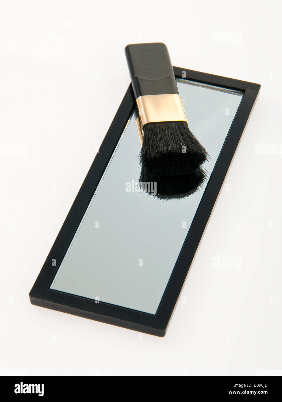 Mirror and brush set for touch-ups Stock Photo - Alamy