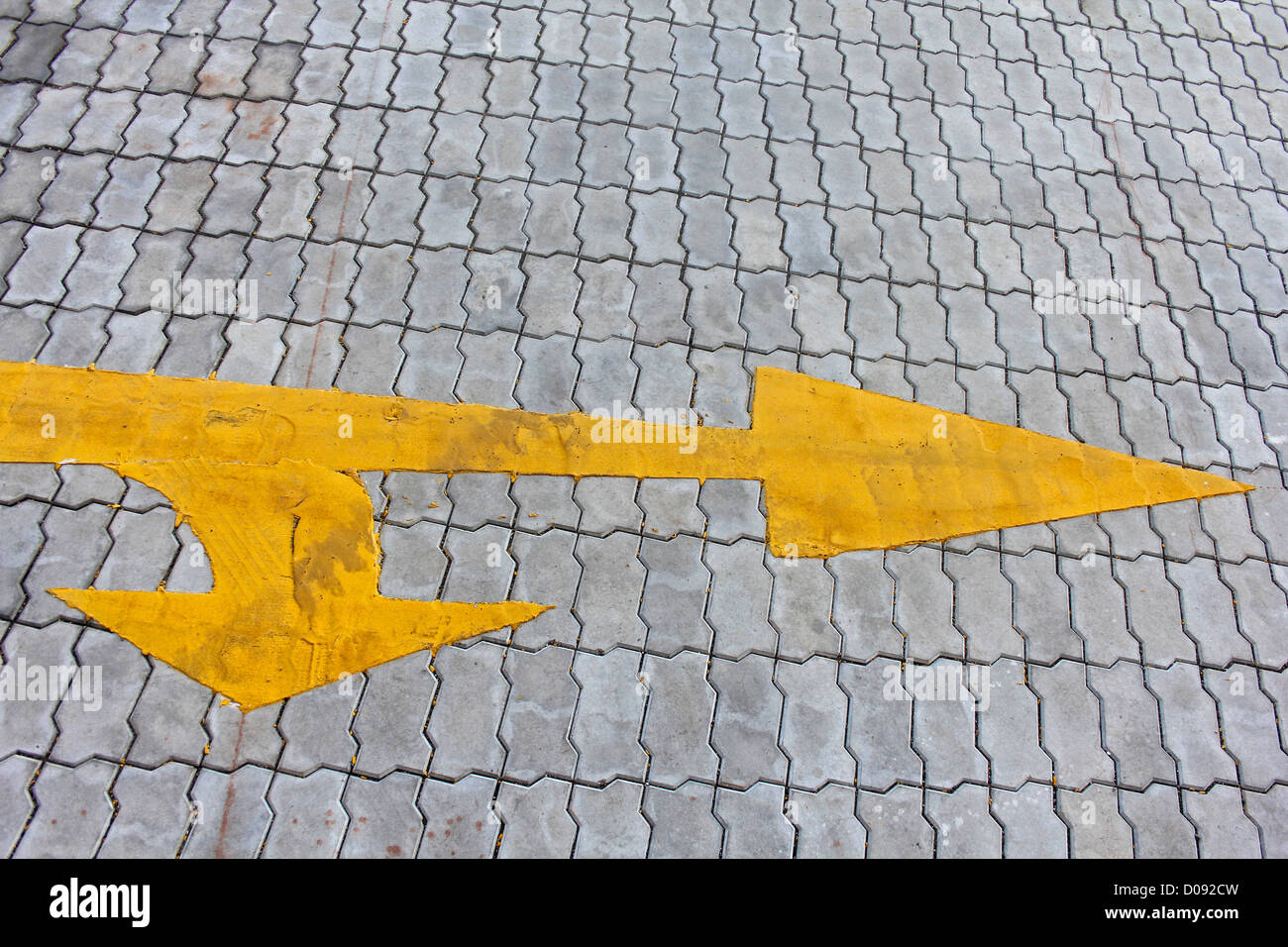 Arrows indicate the direction to be followed by vehicles Stock Photo ...