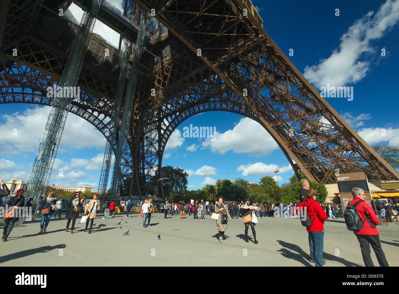 PARIS - OCTOBER 12. Tourists at the foot of the eiffel tower on October ...