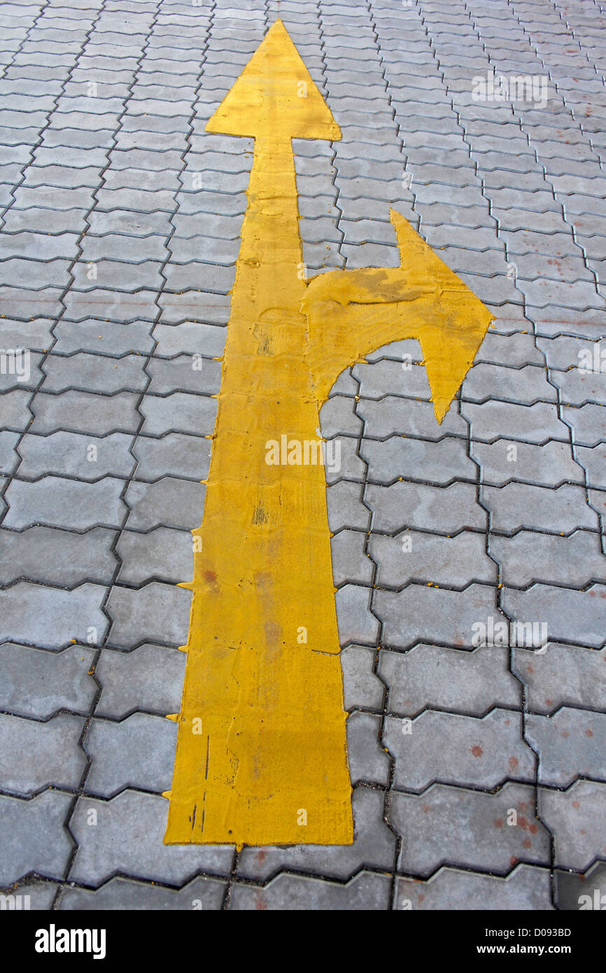 Arrows indicate the direction to be followed by vehicles Stock Photo ...