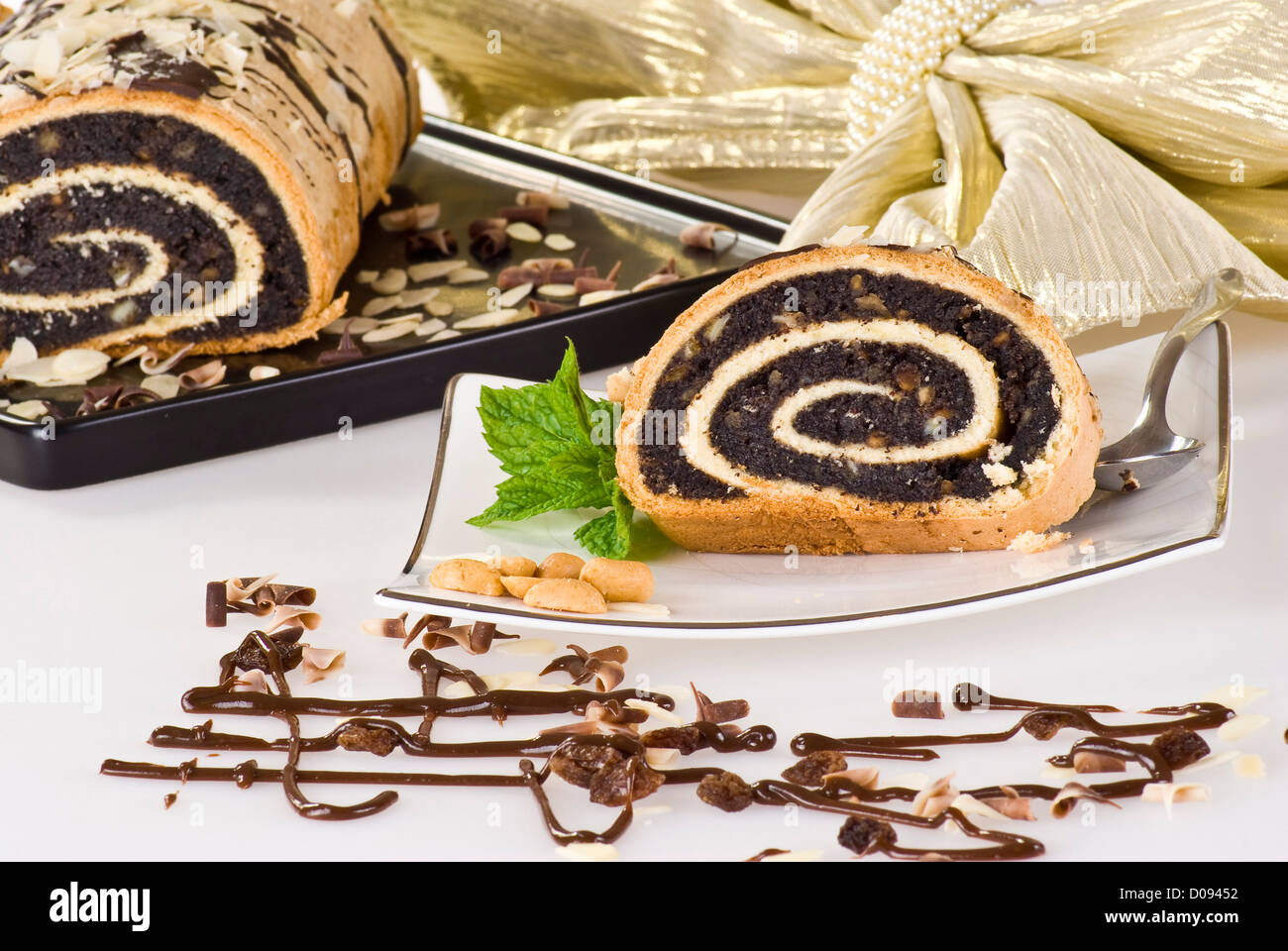 Poppy seed cake on decorated table Stock Photo - Alamy