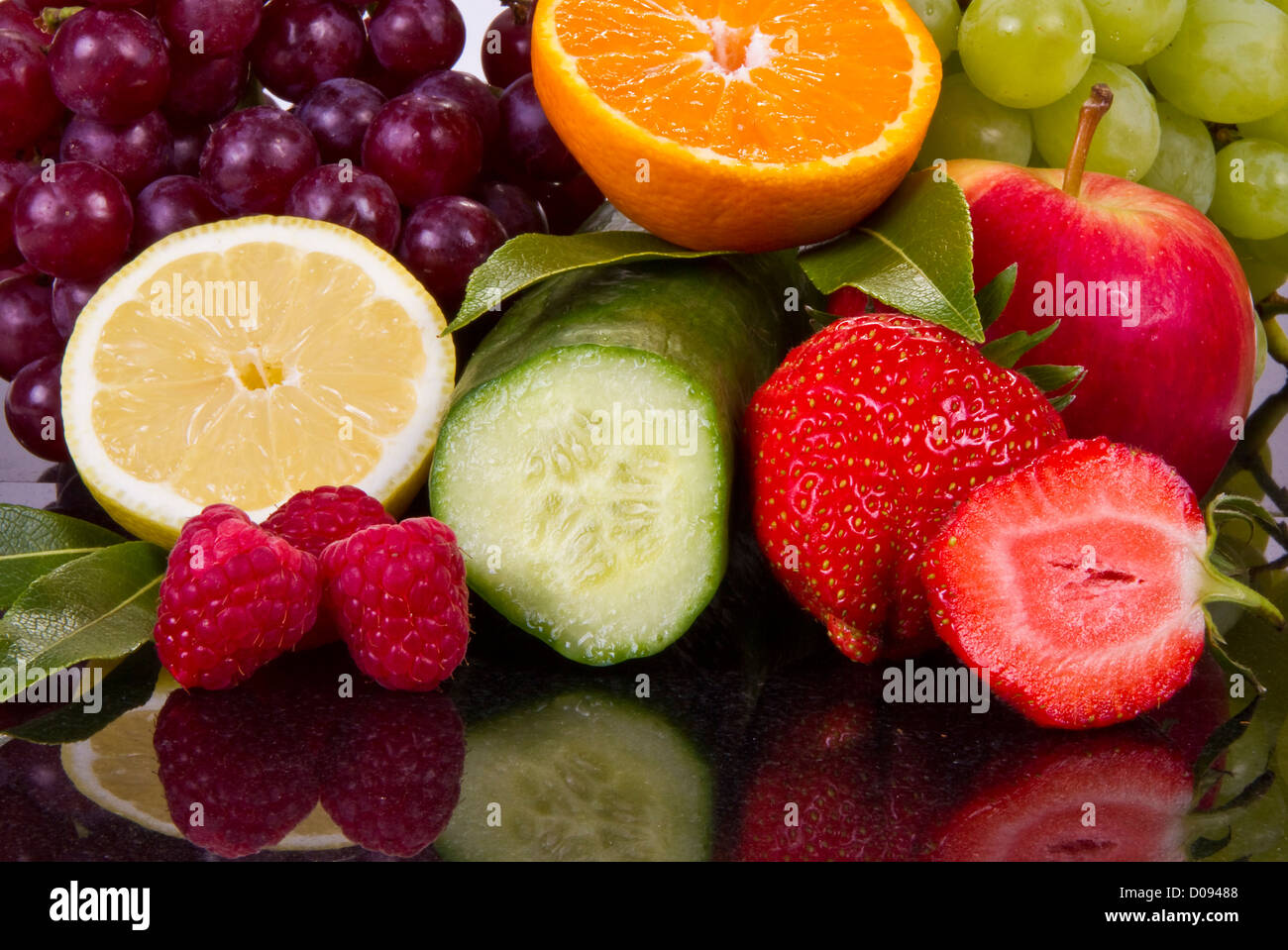 Fruits and cucumber in reflection Stock Photo - Alamy