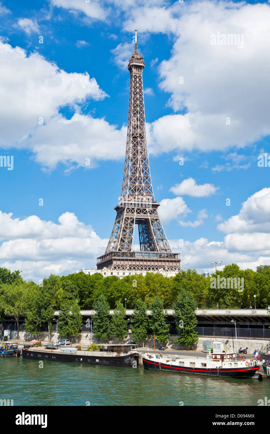 Paris Eiffel tower with boats on the River Seine in the foreground ...