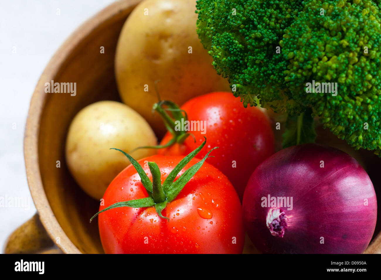 Vegetables in a clay pot. Close-up photo Stock Photo - Alamy
