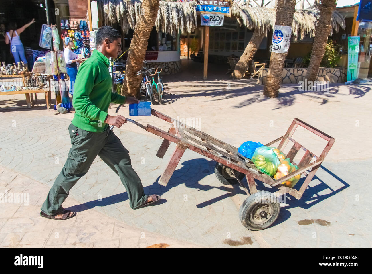 Man pushing market trolley hi-res stock photography and images - Alamy