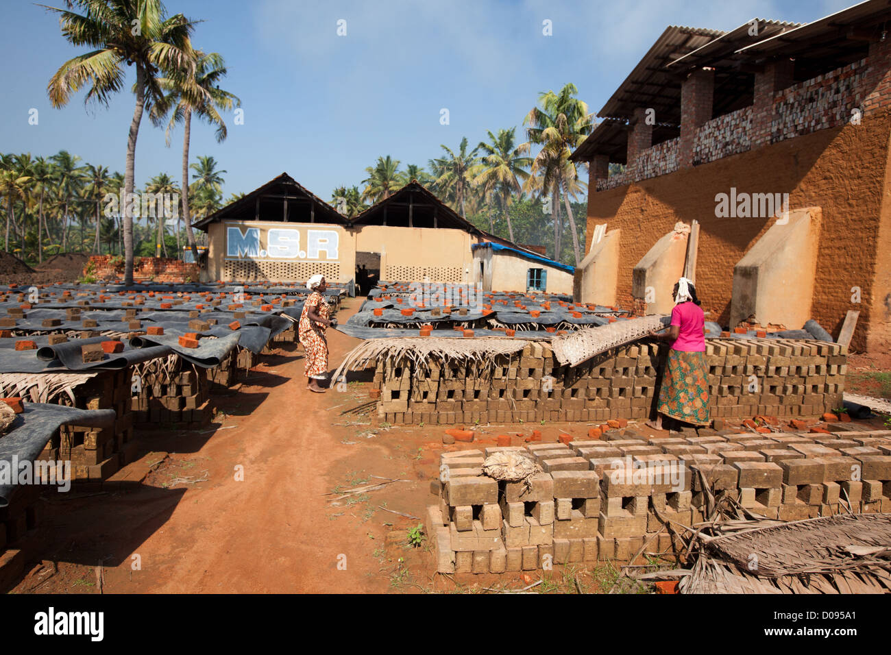 Woman stacking bricks construction hi-res stock photography and images ...
